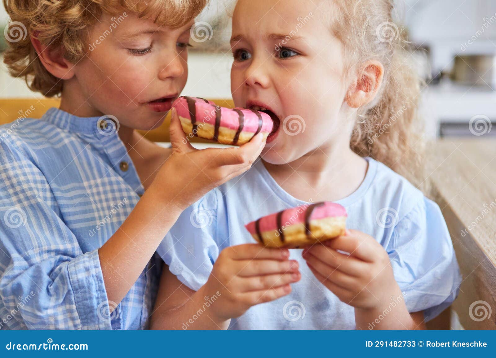 Boy Feeding Donuts To Sister at Home Stock Image - Image of family ...