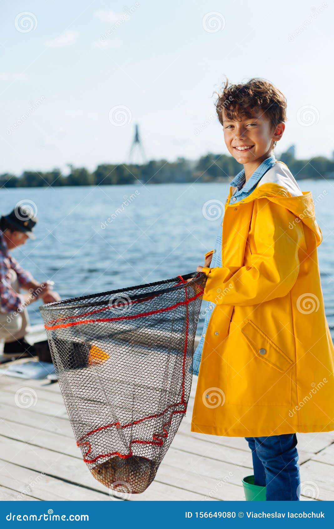 Boy Feeling Satisfied while Having Fish in the Fishing Net Stock Photo ...