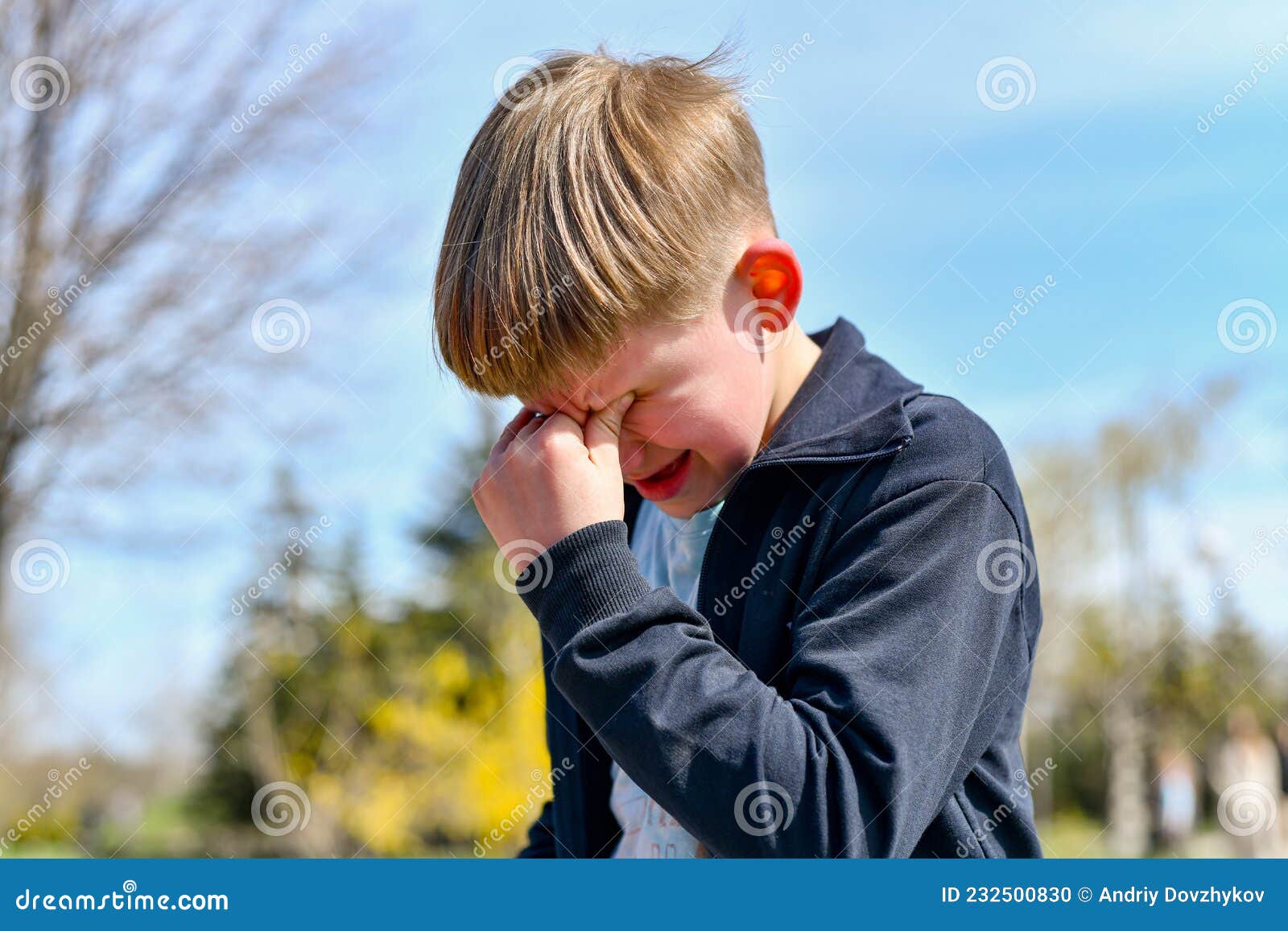 The Boy Fell while Walking in the Park and Cries with Tears Stock Photo ...