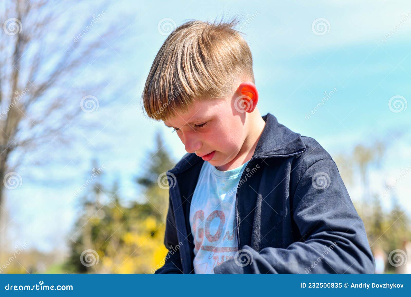 The Boy Fell while Walking in the Park and Cries with Tears Stock Image ...