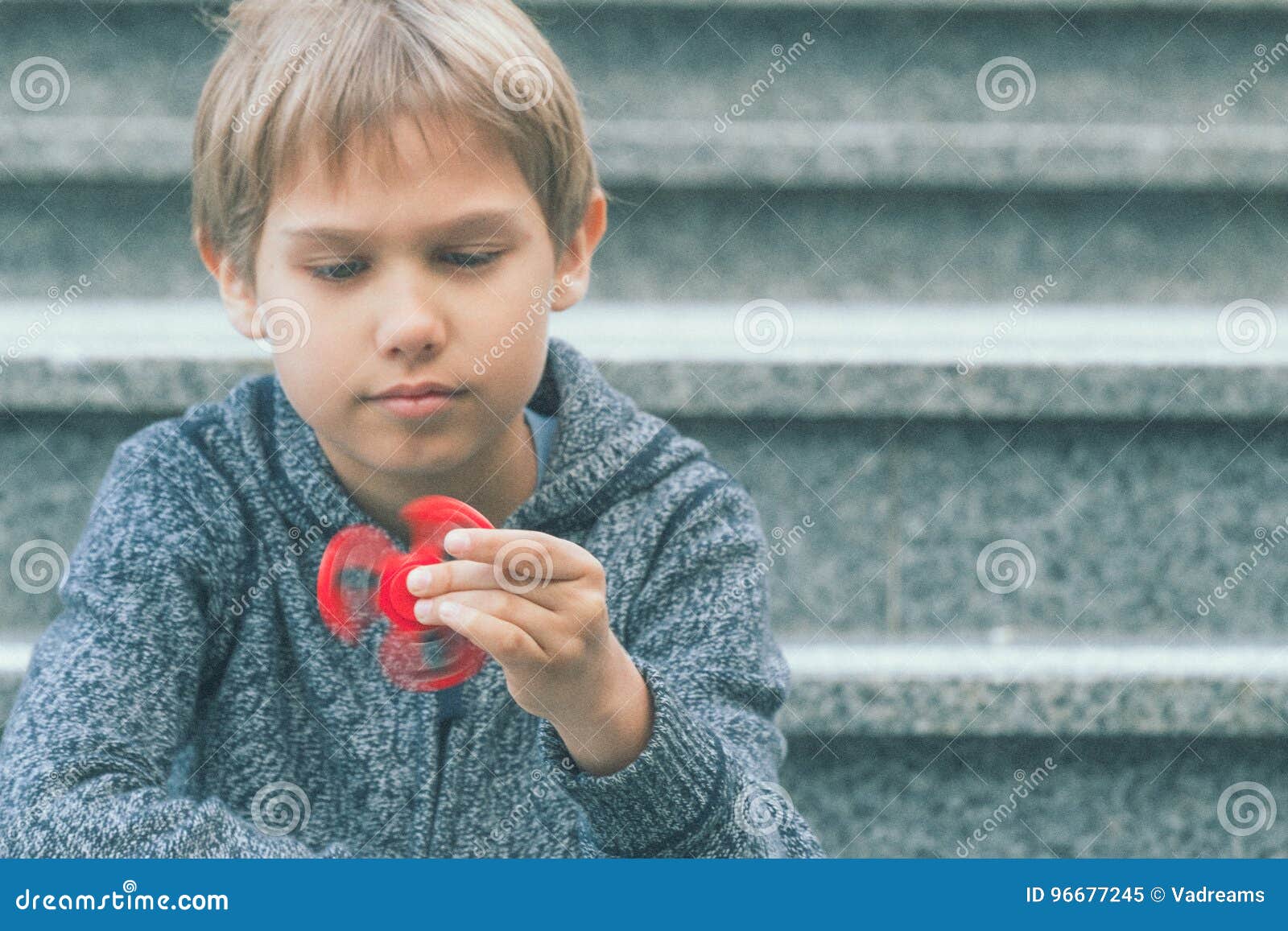 Boy with a Fidget Spinner Outdoors Stock Image - Image of outdoor ...