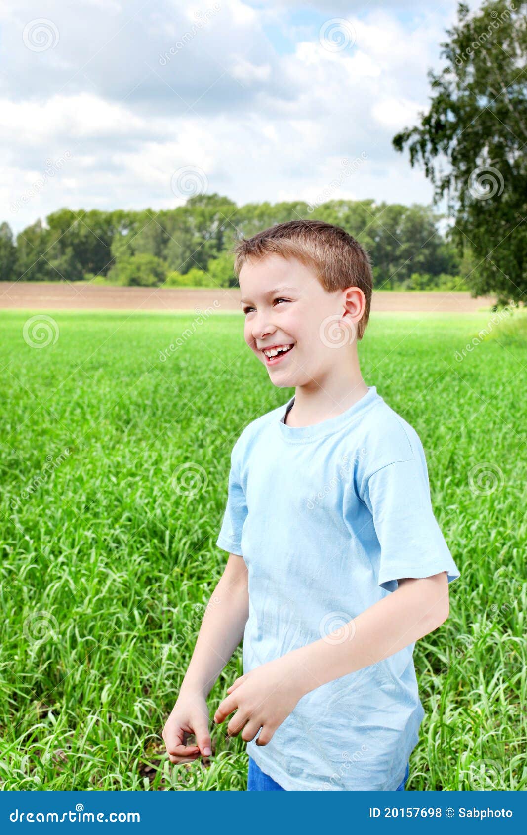 Boy in the field stock photo. Image of field, smile, clouds - 20157698