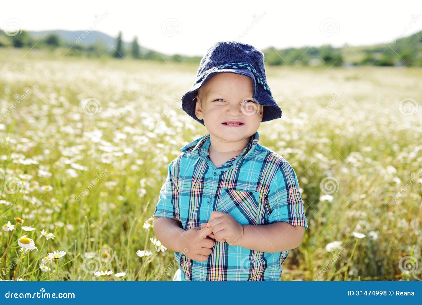 Boy in field stock photo. Image of green, blue, flower - 31474998