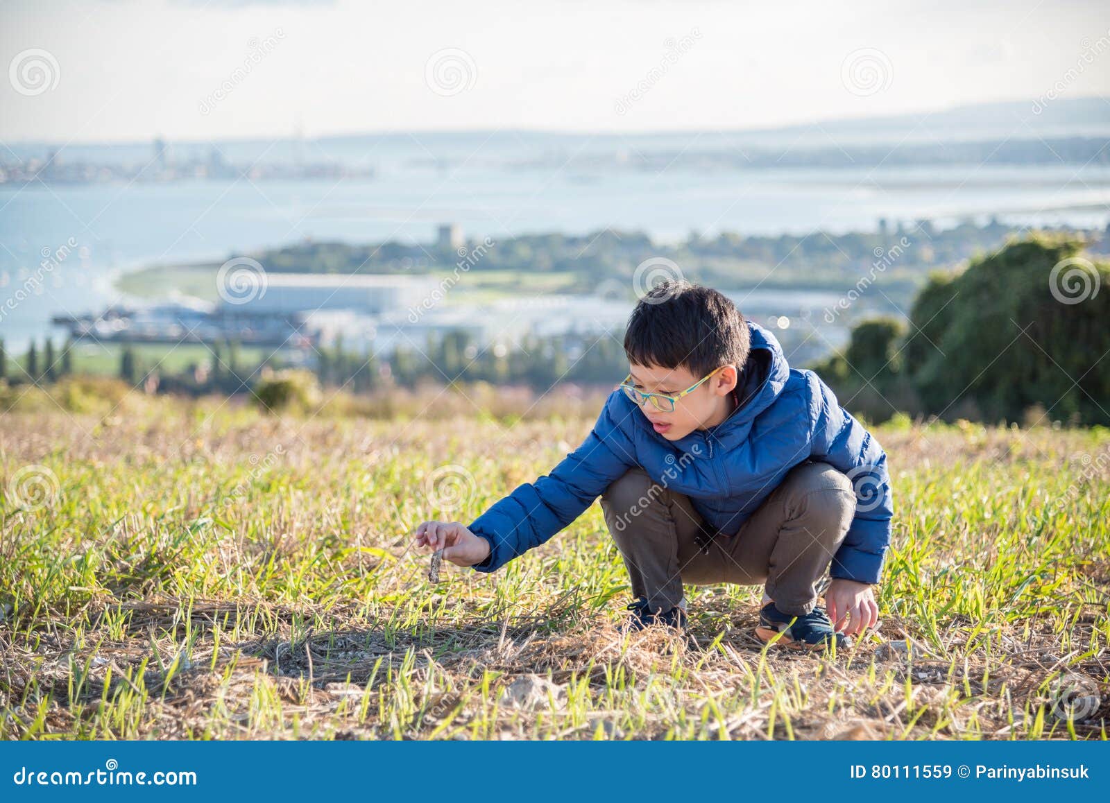 Boy Finding Stone on the Ground Stock Image - Image of explore, happy ...