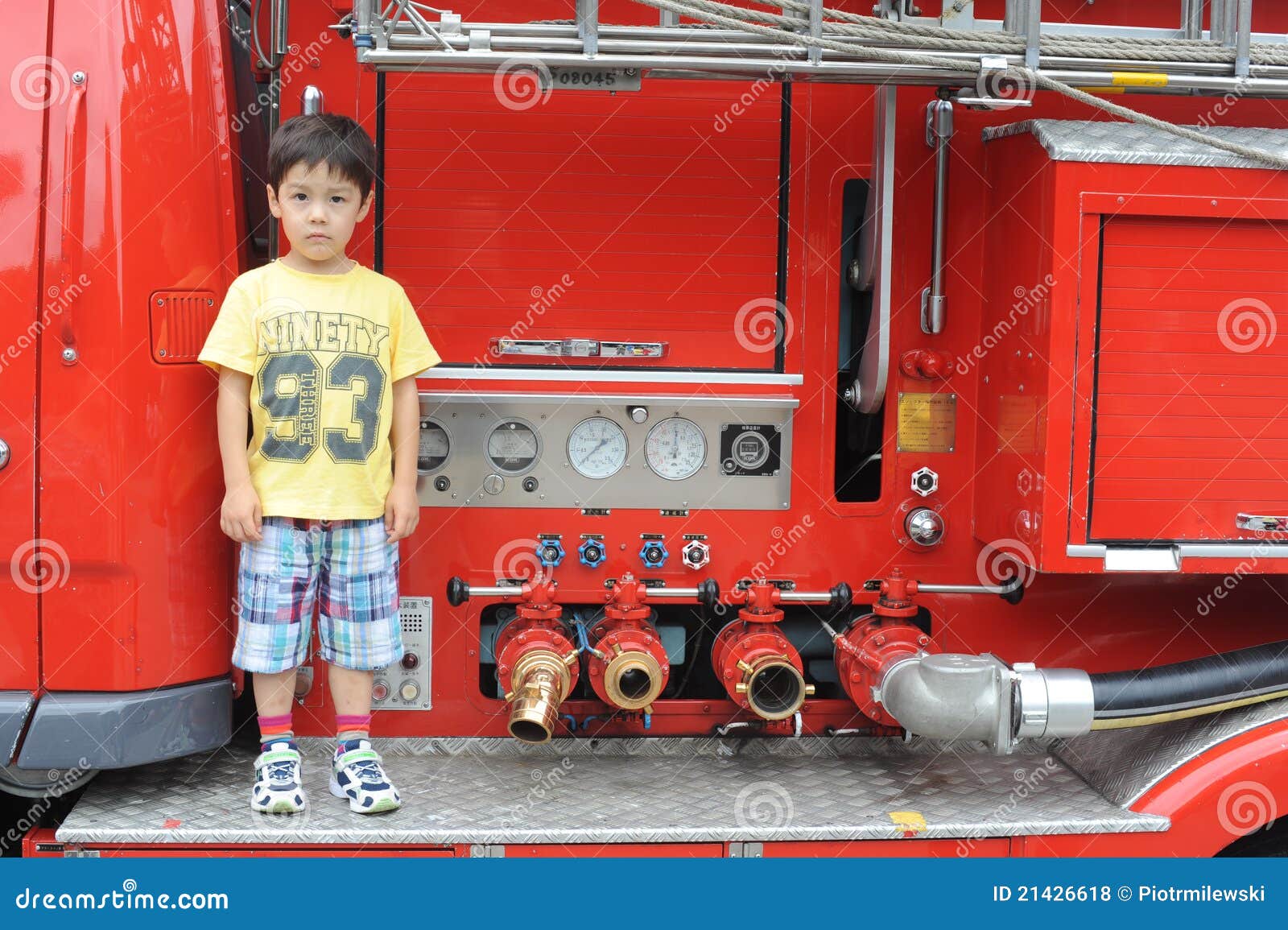 Boy on a fire engine stock photo. Image of curious, face - 21426618