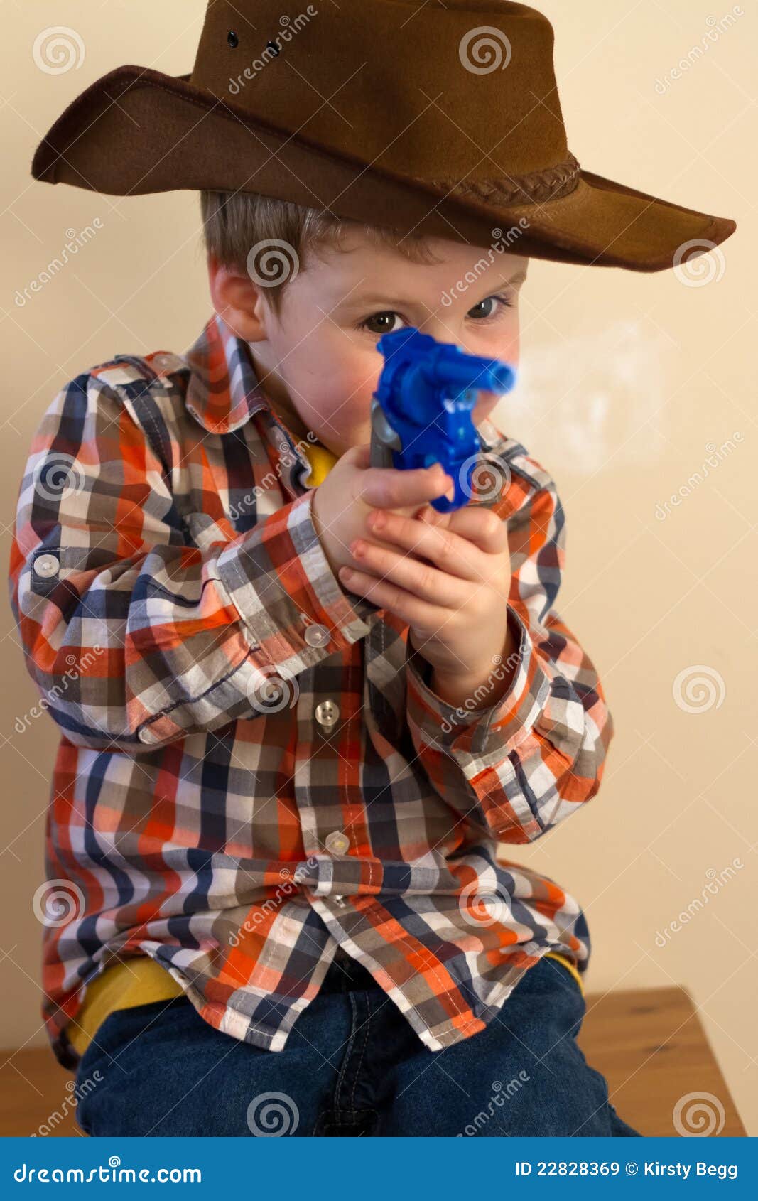 Boy firing cap gun stock image. Image of plastic, concentration - 22828369