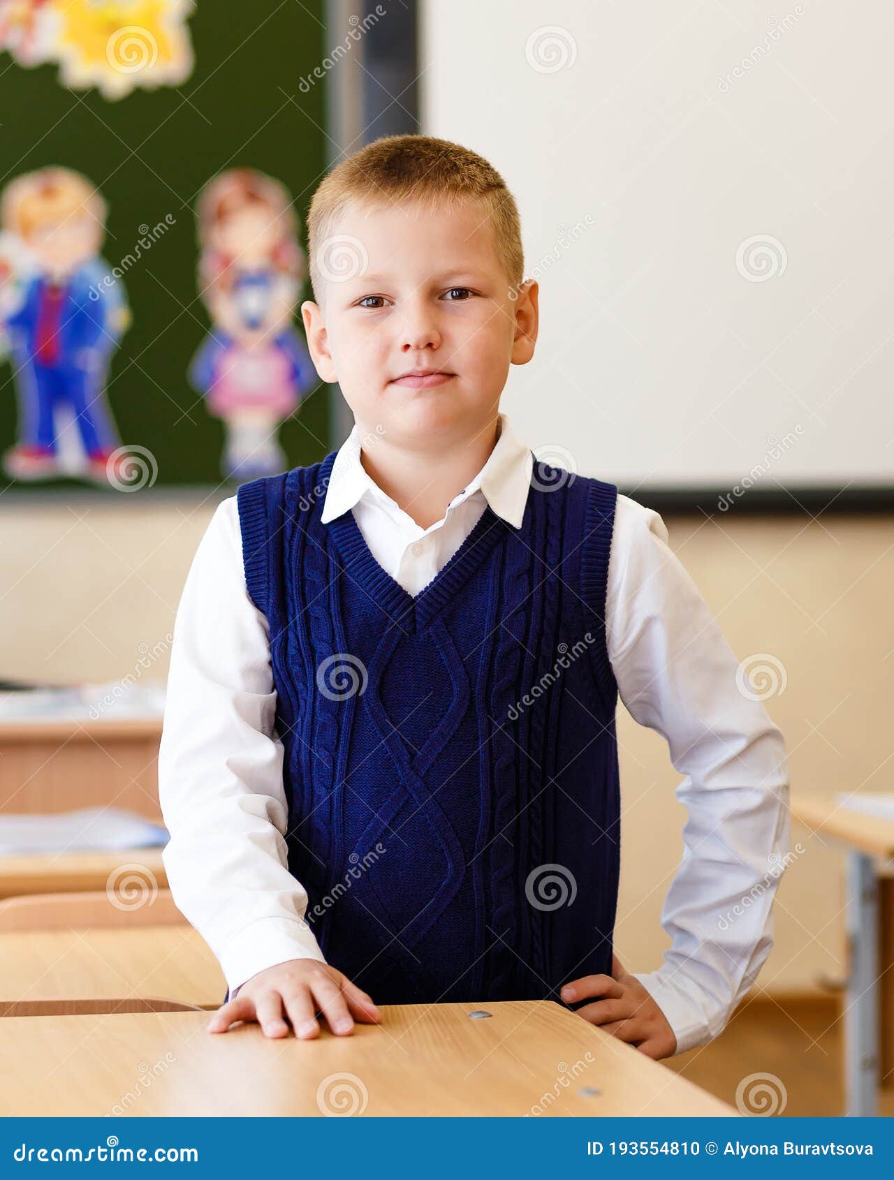 Boy First-grader in School Uniform Sits at Desk Stock Photo - Image of ...