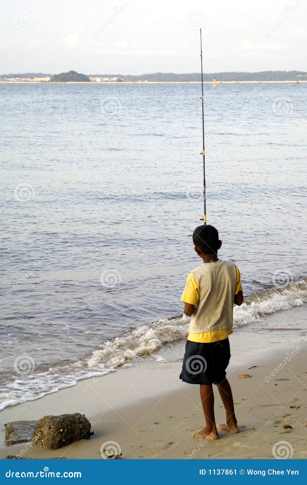 Boy fishing at beach stock image. Image of weekend, lonely - 1137861