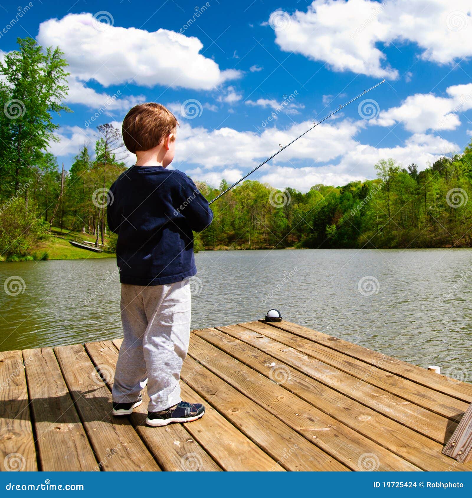 Boy fishing from dock stock photo. Image of happy, elementary - 19725424