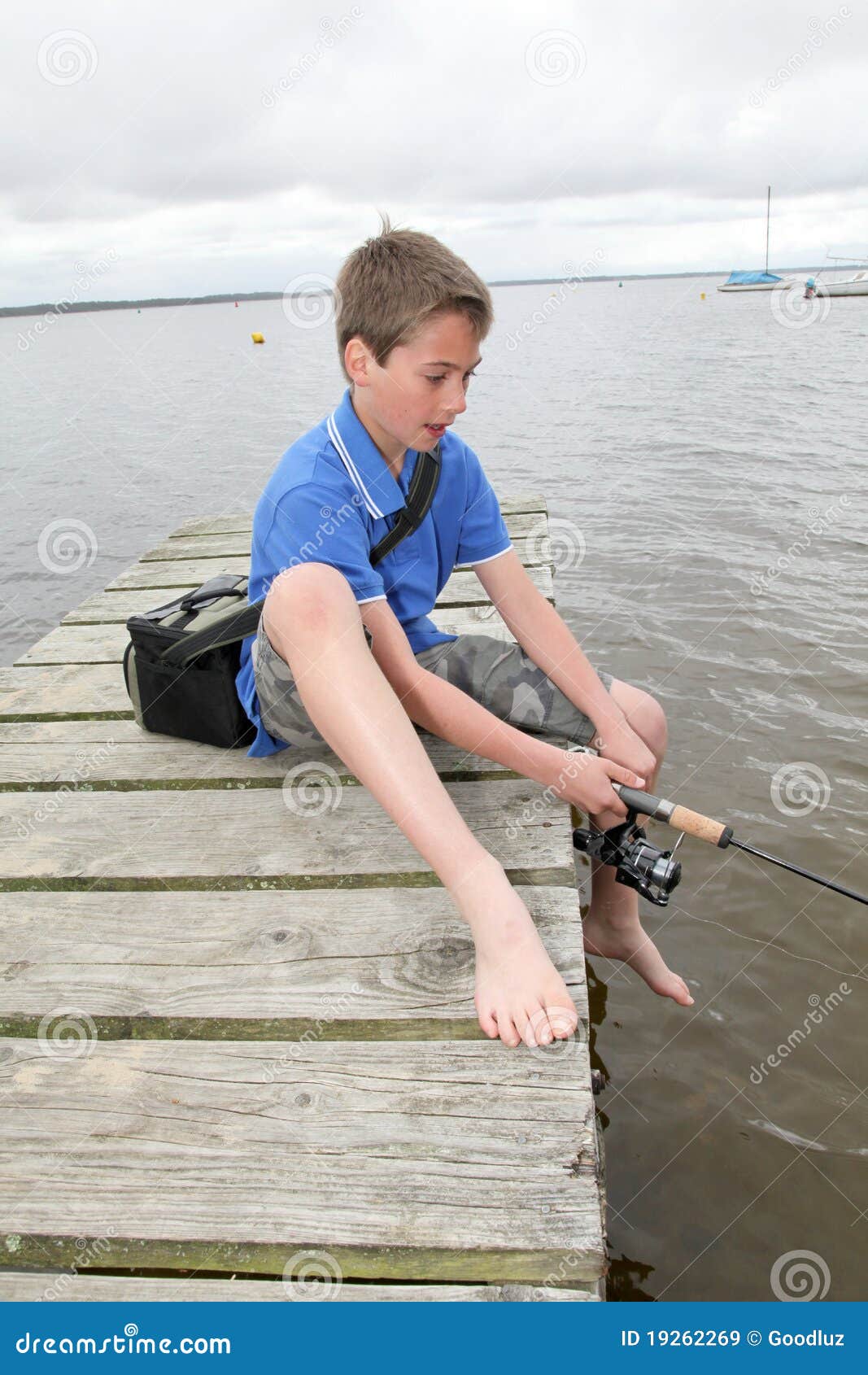 Boy fishing in lake stock image. Image of sport, pontoon - 19262269