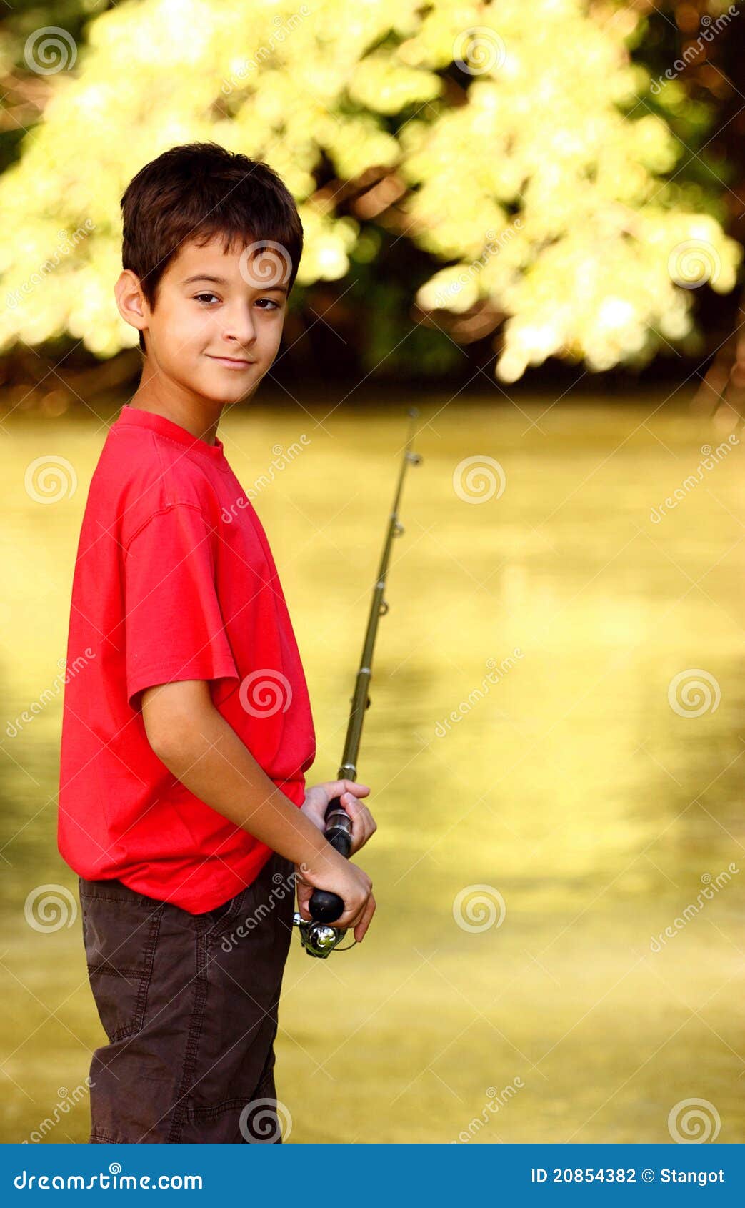 A boy with fishing rod stock photo. Image of catching - 20854382