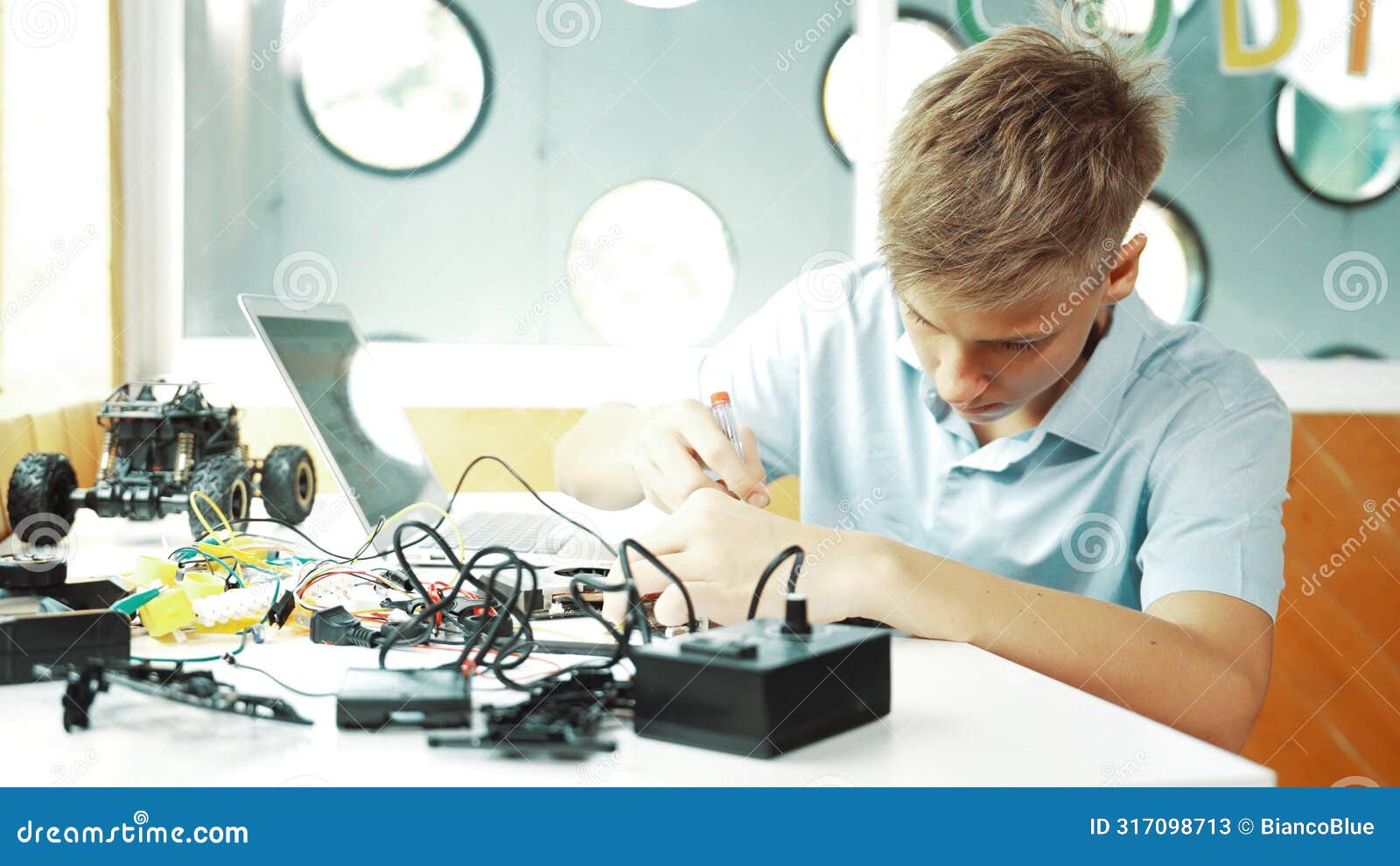 Boy Fixing Main Board while Study Construction by Using Laptop ...