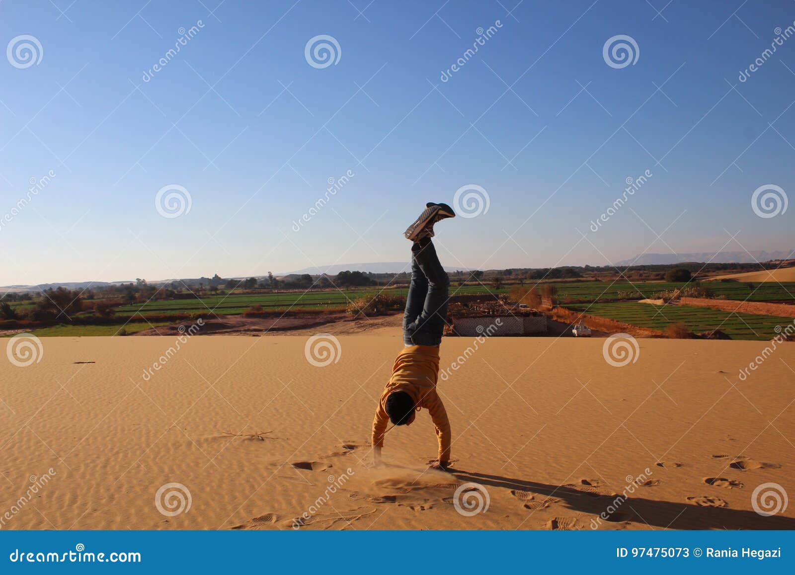 Boy flipping upside down editorial stock photo. Image of daytime - 97475073