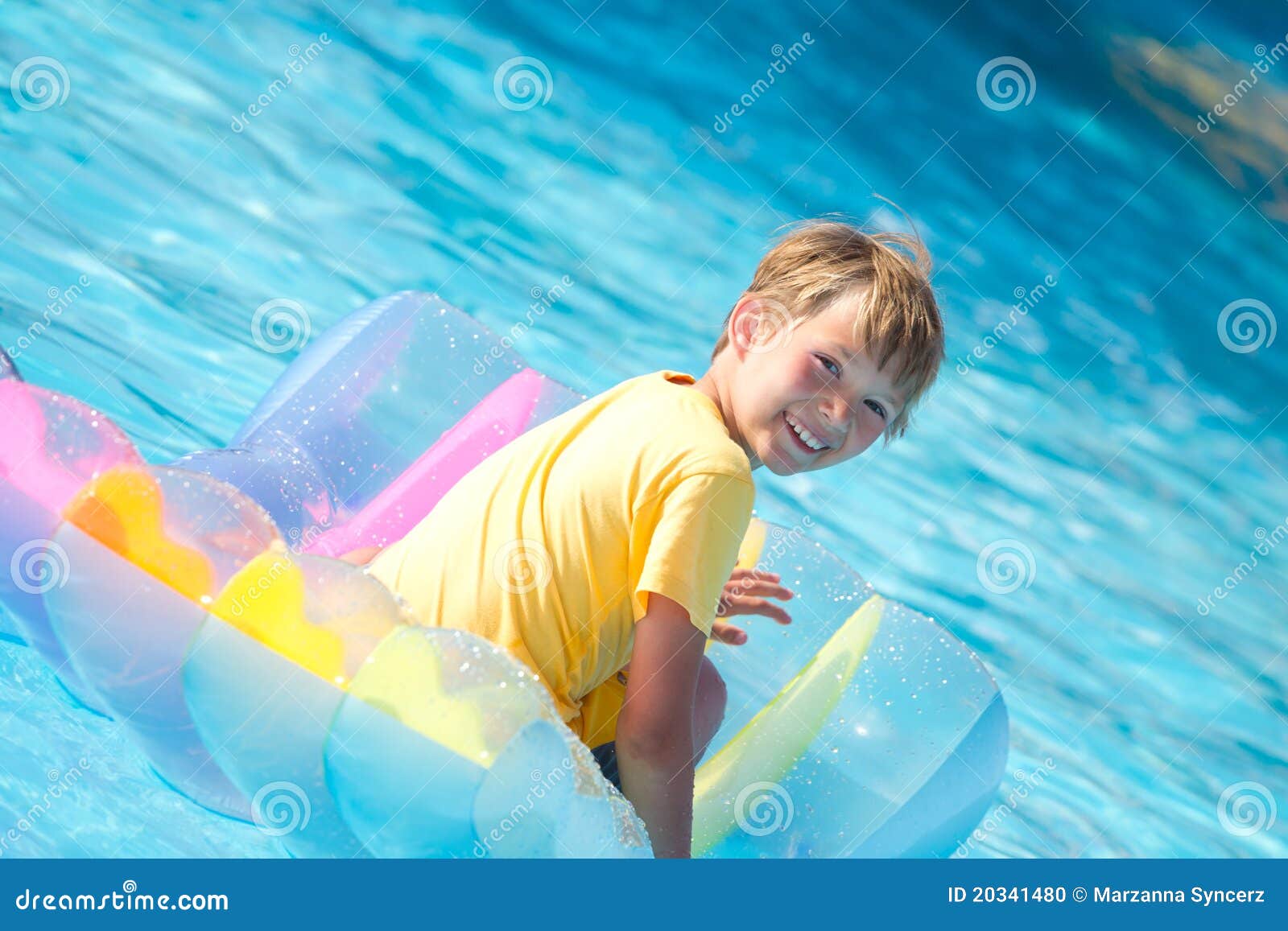 Boy on float swimming pool stock photo. Image of swimming - 20341480