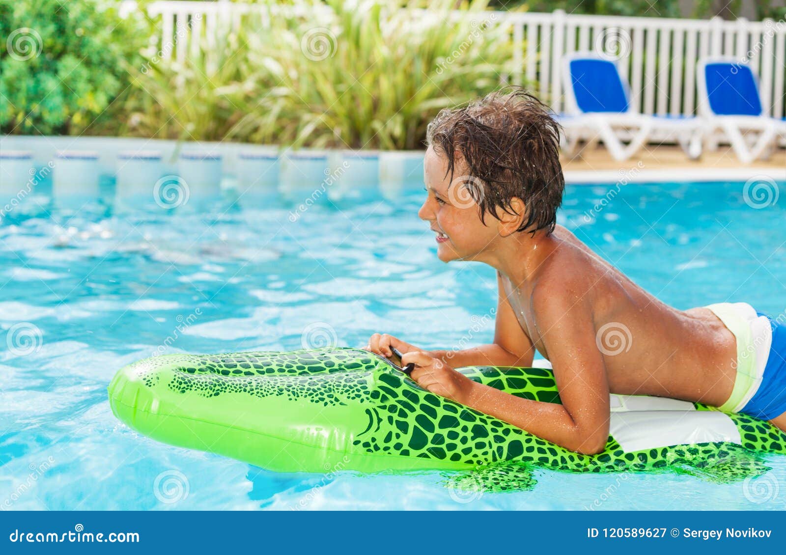Boy Floating on Inflatable Toy in Swimming Pool Stock Image - Image of ...