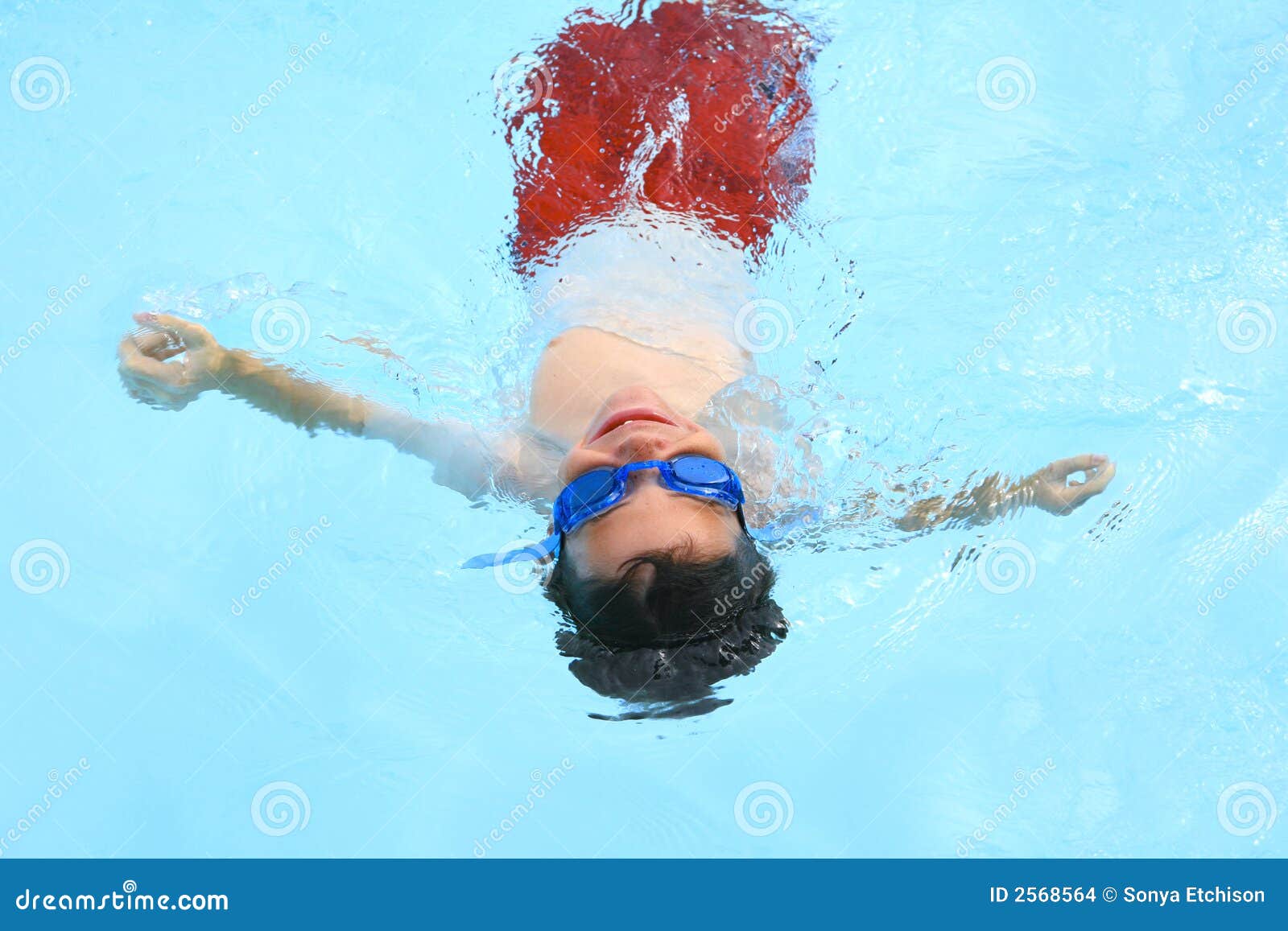 Boy Floating in Pool stock photo. Image of goggles, cute - 2568564
