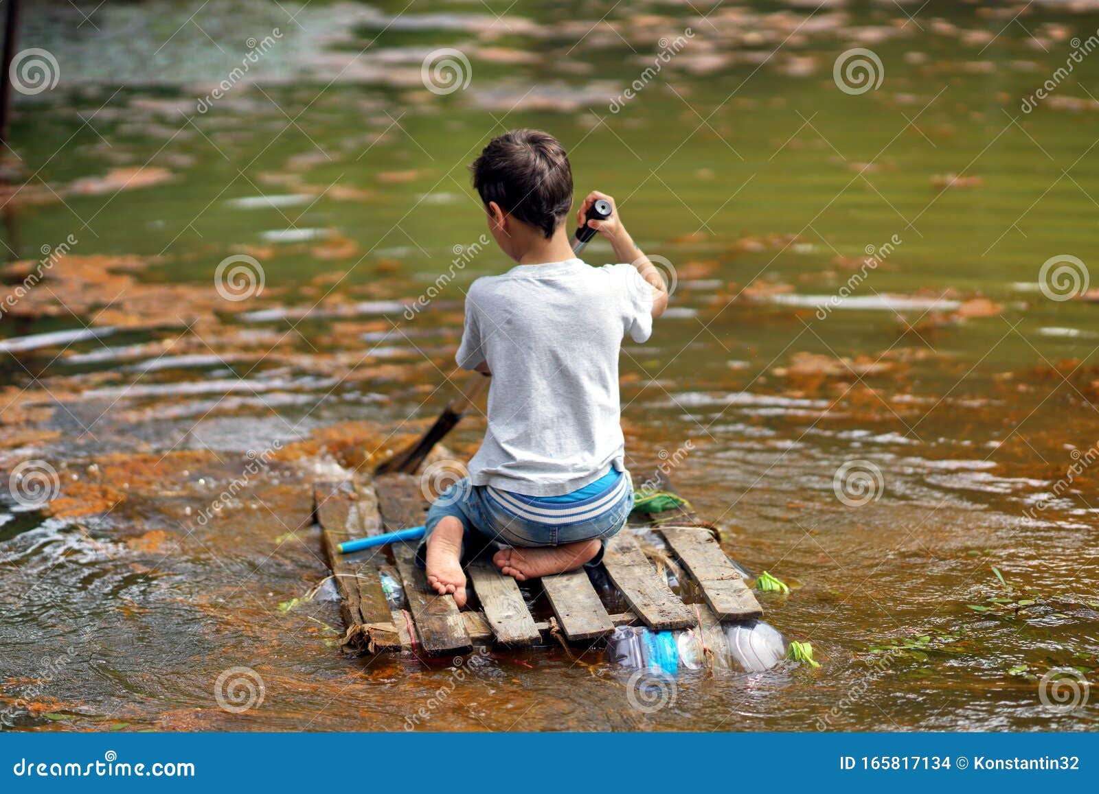 The boy floating on a raft stock photo. Image of adorable - 165817134