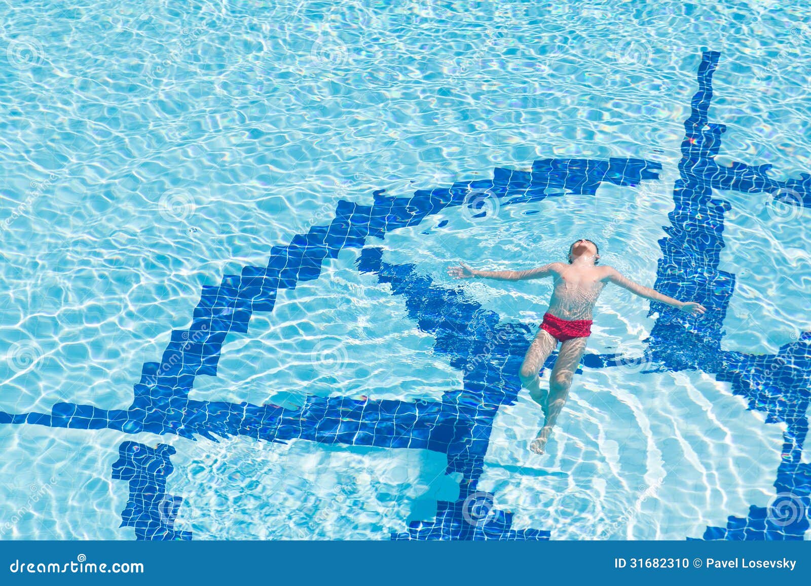A Boy Floats in the Pool Face Up Stock Photo - Image of pool, rest ...