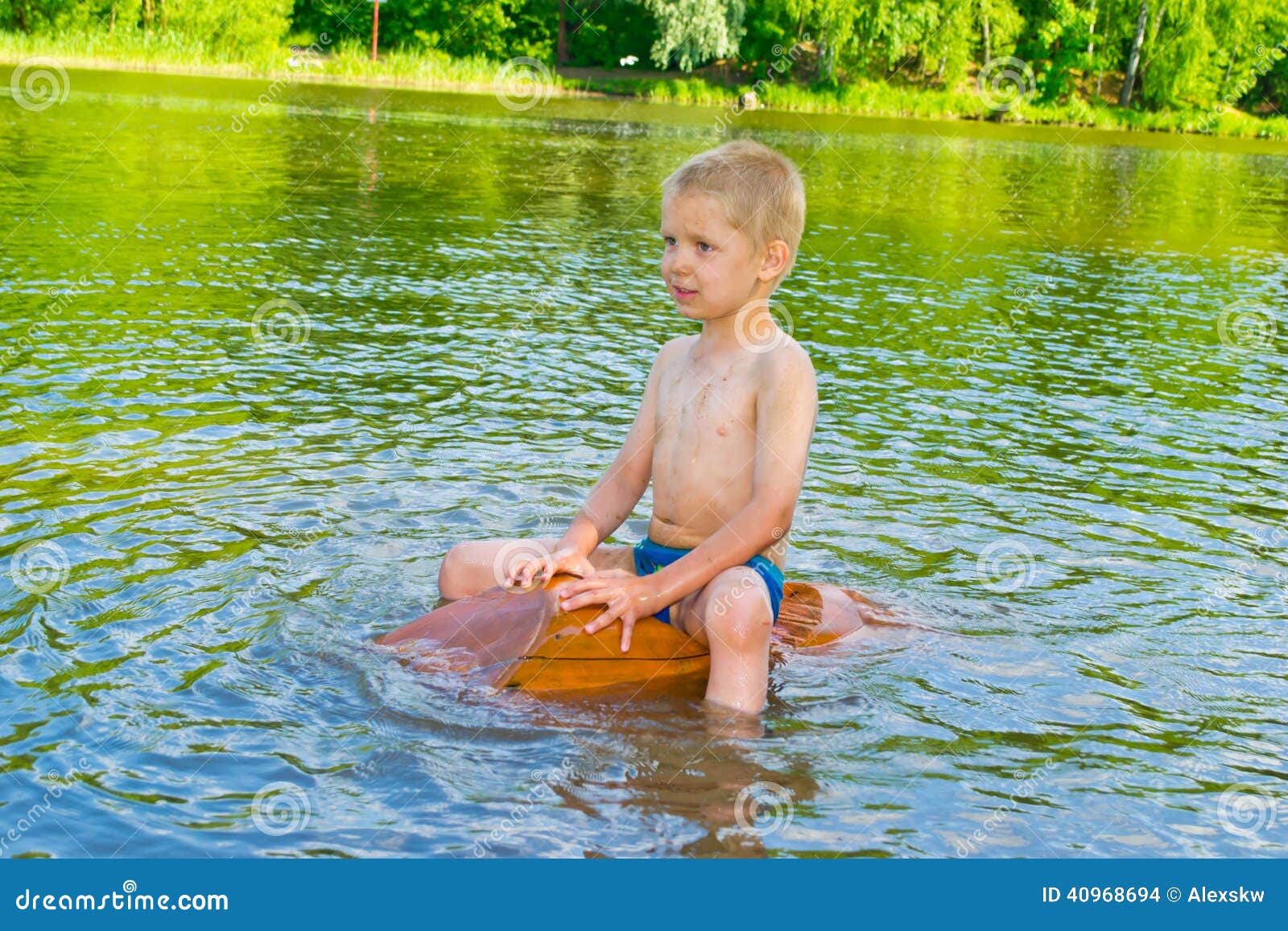 Boy floats on the river stock photo. Image of lake, eyes - 40968694