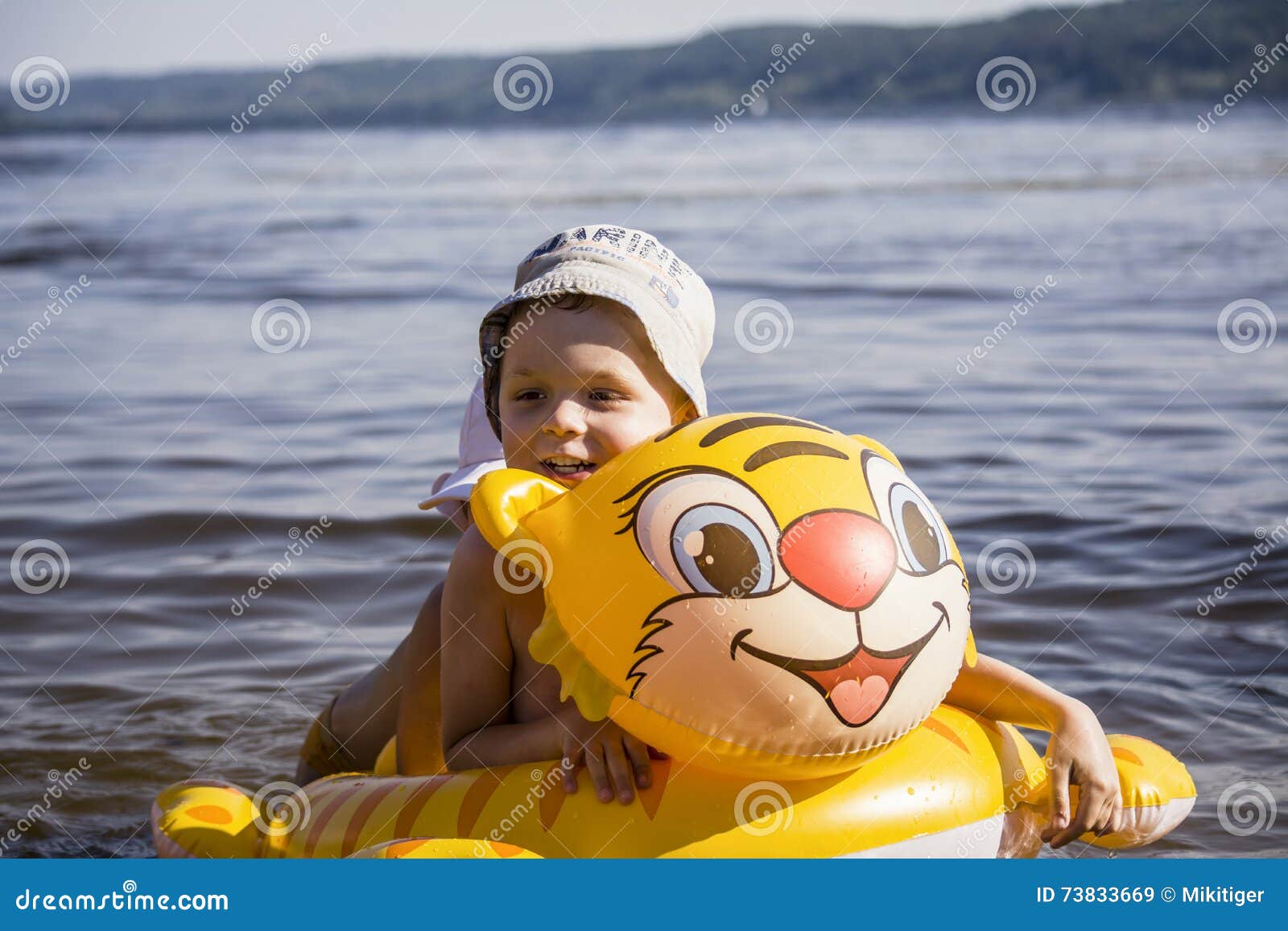 Boy floats on the sea stock image. Image of inflatable - 73833669