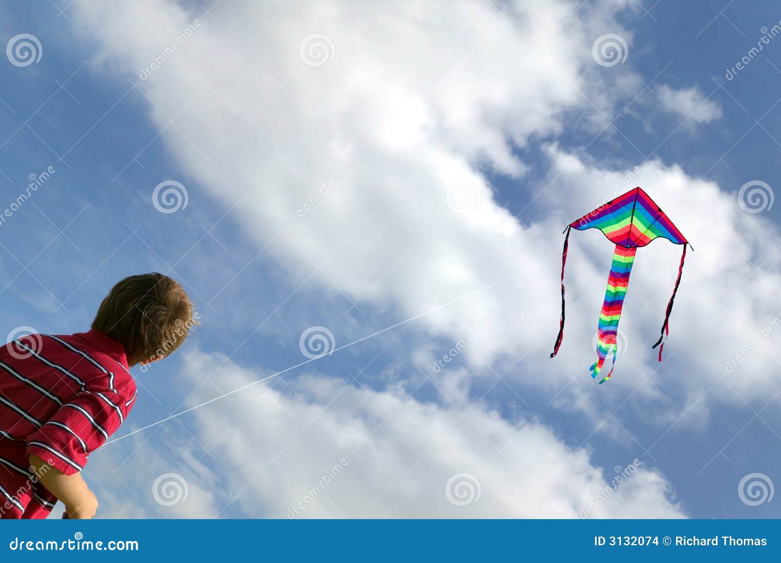 Boy flying a kite. stock photo. Image of cloud, youth - 3132074