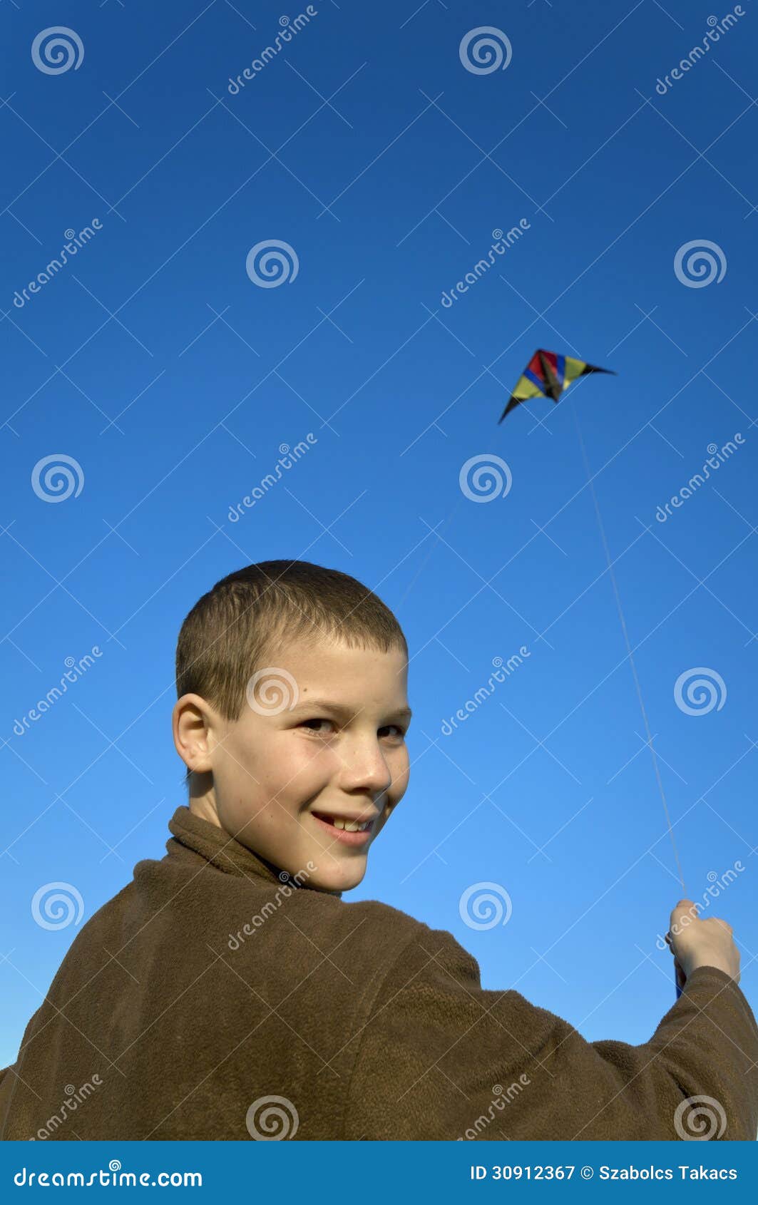 Boy Flying a Kite Close Face Stock Image - Image of activity, distant ...