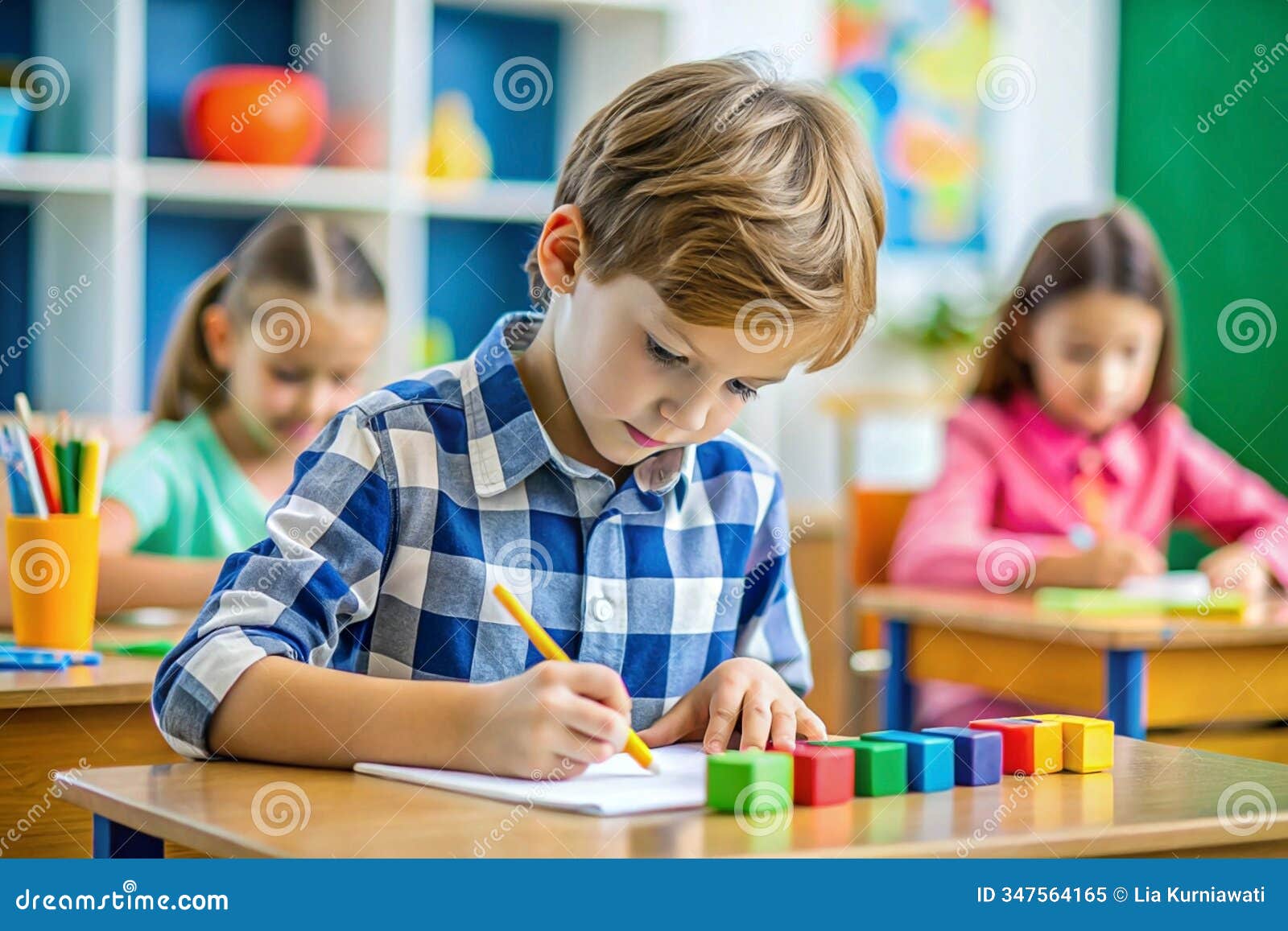 Boy Focused on Drawing at School Desk with Classmates Stock ...