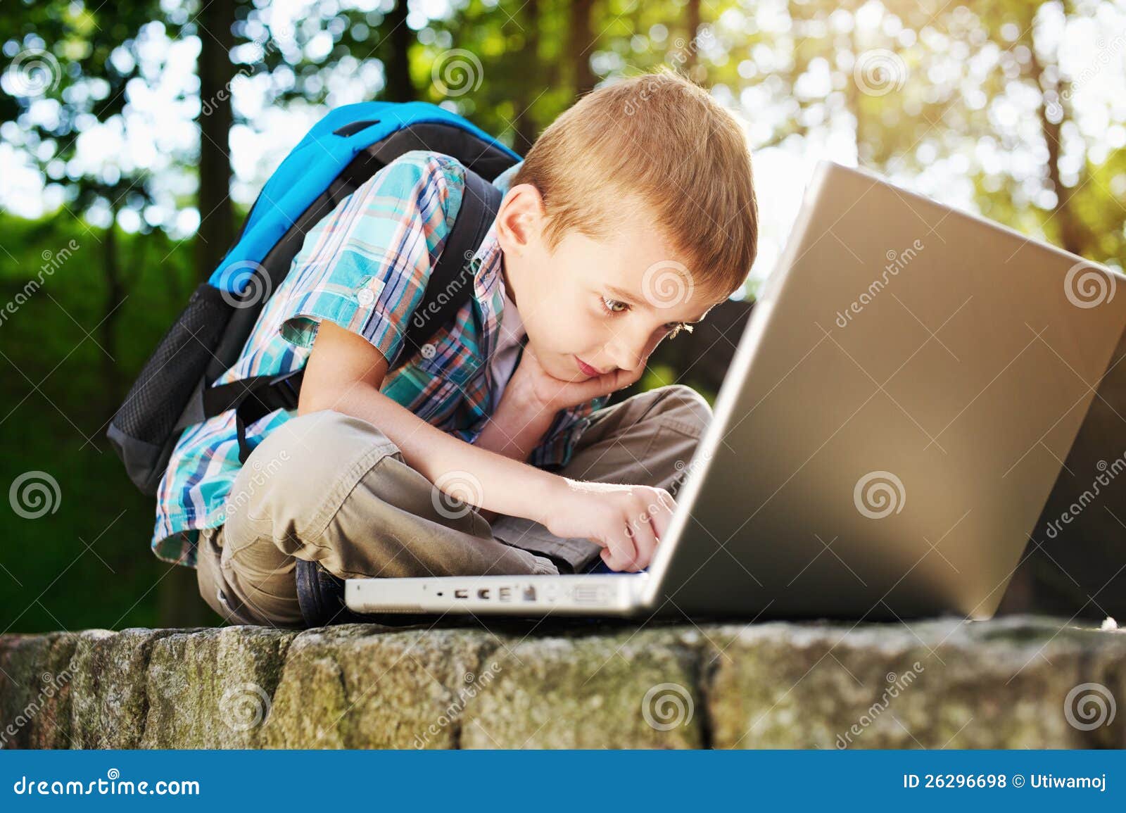Boy focused on notebook stock photo. Image of browse - 26296698