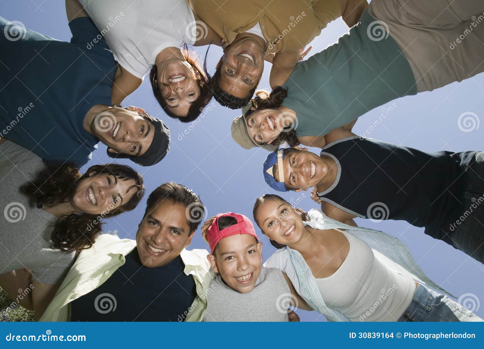Boy (13-15) with Friends and Family in Huddle View from Below. Stock ...