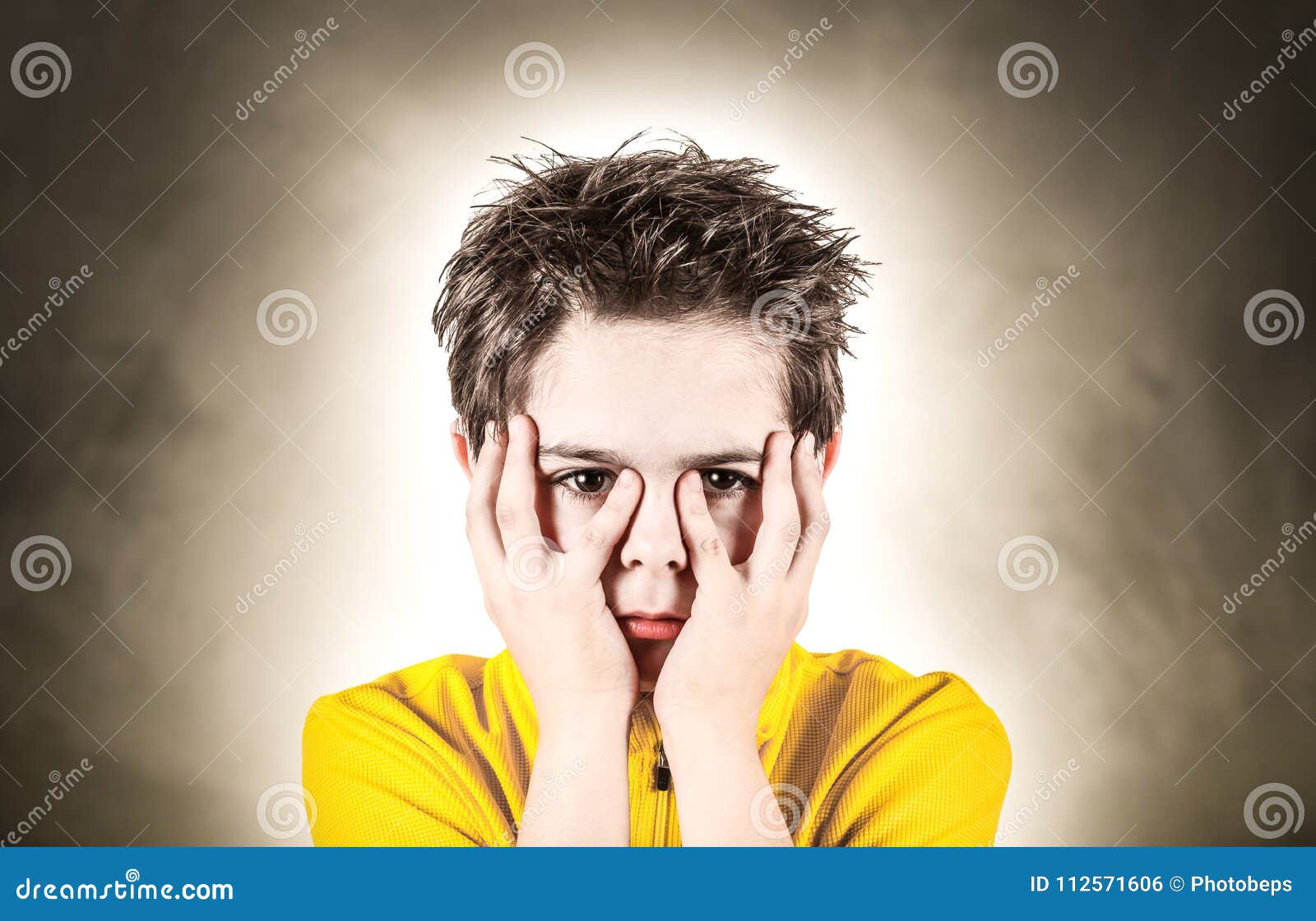 Boy with frightened look stock photo. Image of white - 112571606