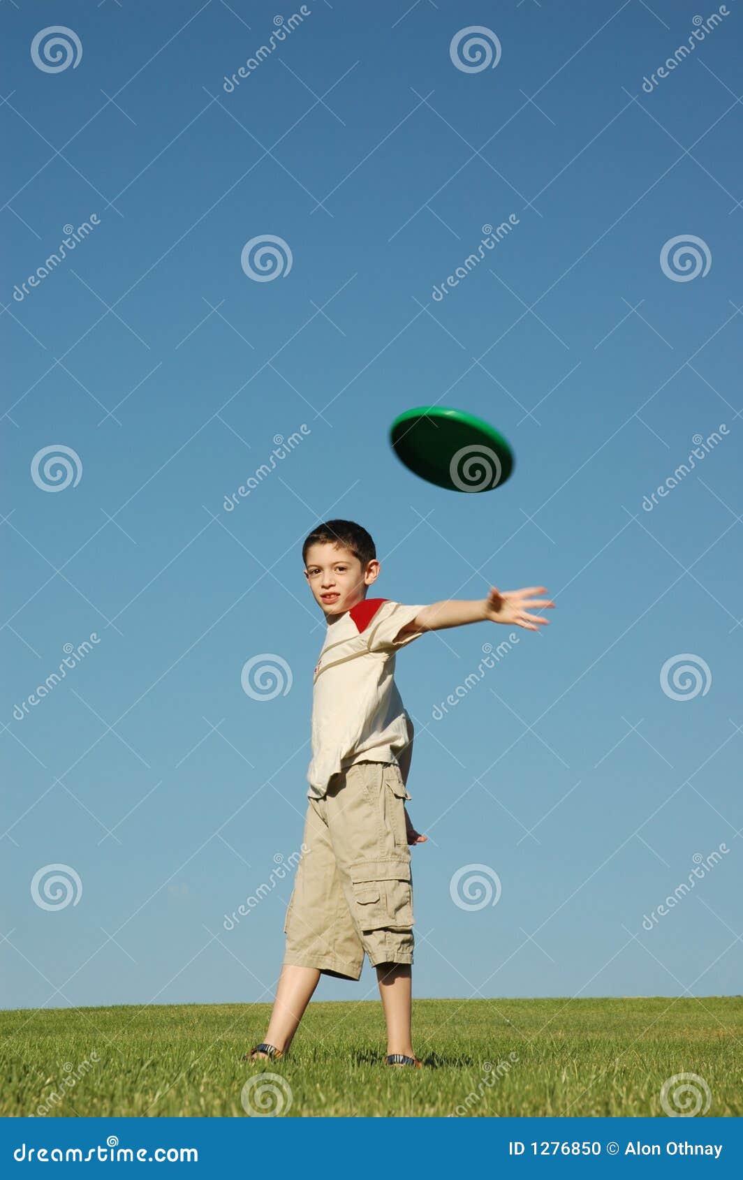 Boy with frisbee stock photo. Image of outdoors, blue - 1276850
