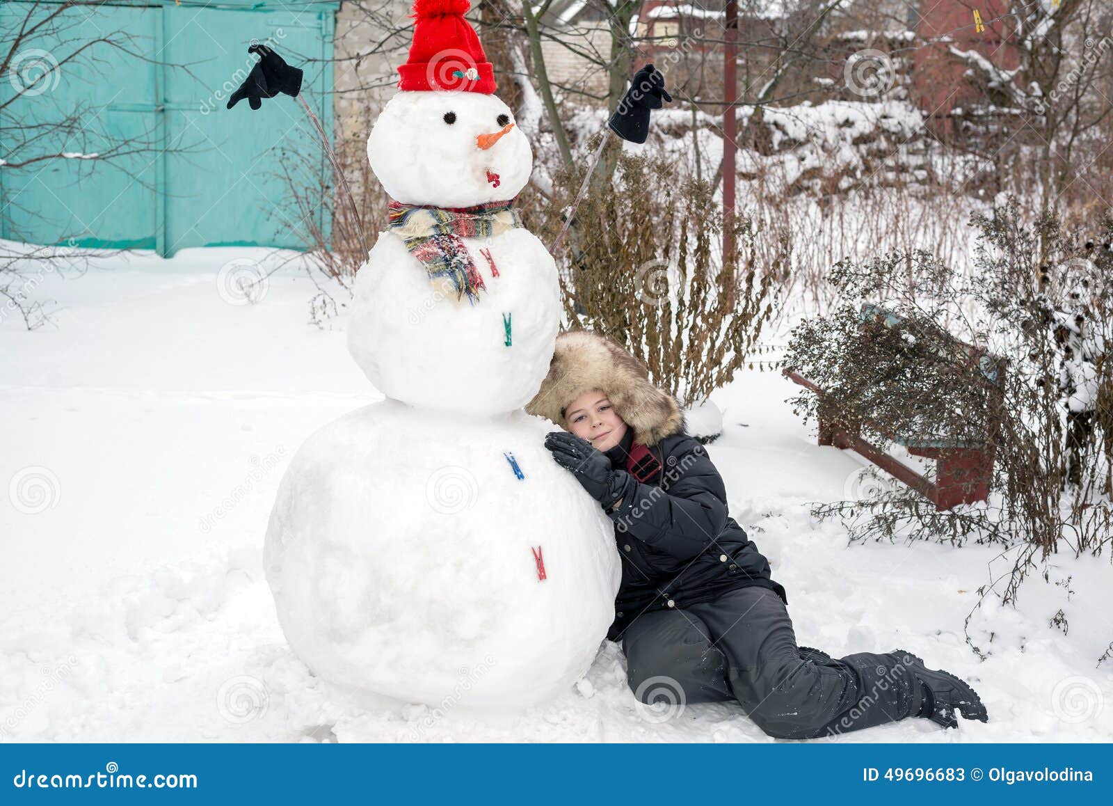 The Boy in a Fur Hat Around Snowman Stock Image - Image of male ...