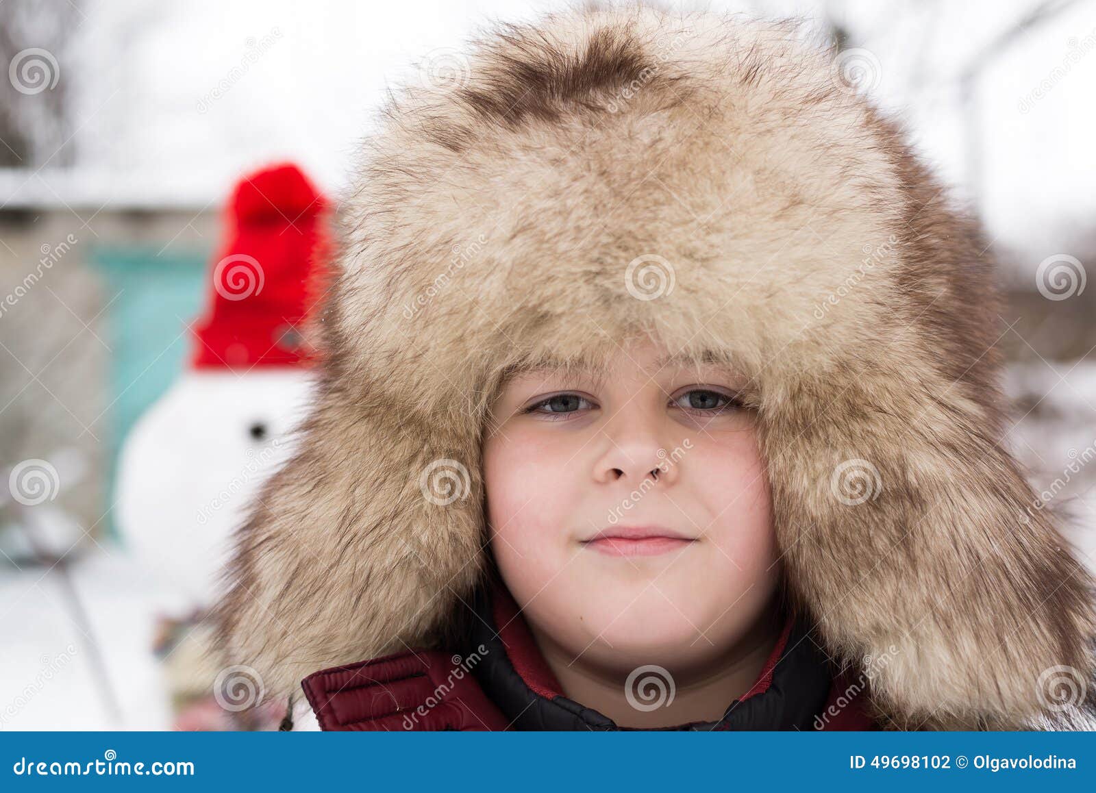 The Boy in a Fur Hat Around Snowman Stock Photo - Image of expression ...