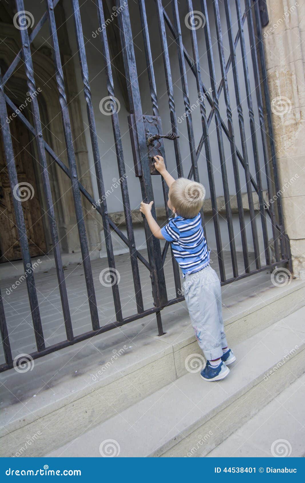 Boy and the gate stock image. Image of concentrate, open - 44538401