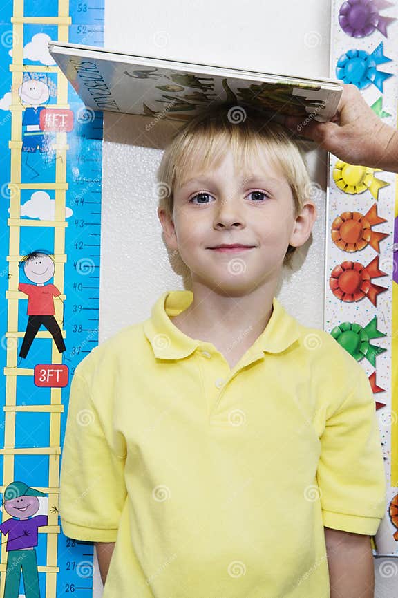 Boy Getting Height Measured by Teacher Stock Image - Image of ...