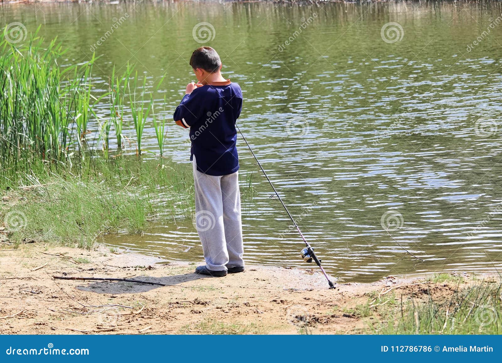 A Boy Getting His Hook Ready for Fishing Stock Photo - Image of canada ...