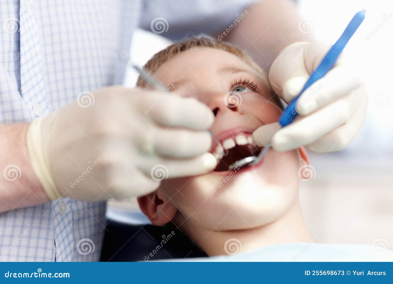 Boy Getting His Teeth Checked. High Angle View of Cute Boy Getting His ...