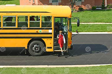 Boy Getting off School Bus stock photo. Image of drive - 1315080