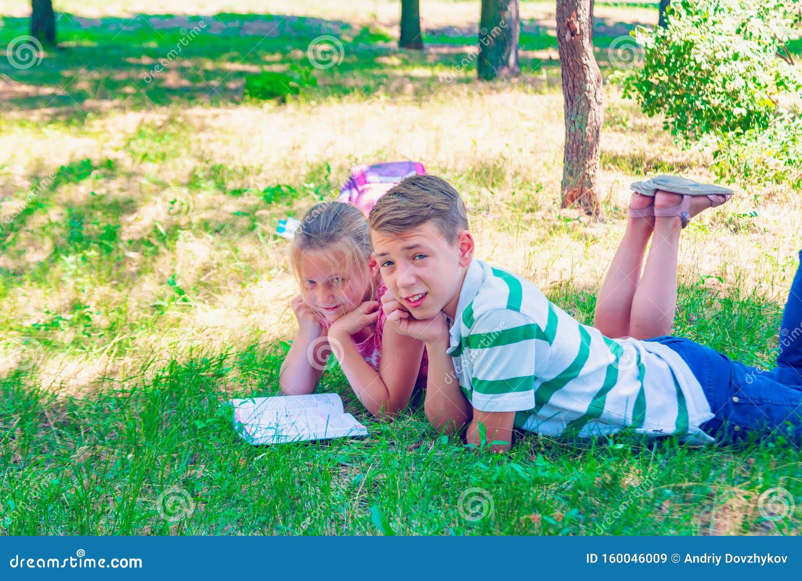 Boy with a Girl Doing Homework on the Grass in the Park Stock Image ...