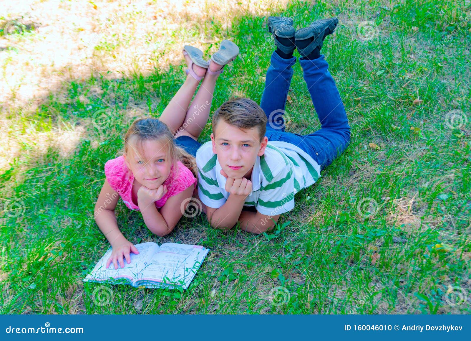 Boy with a Girl Doing Homework on the Grass in the Park Stock Photo ...