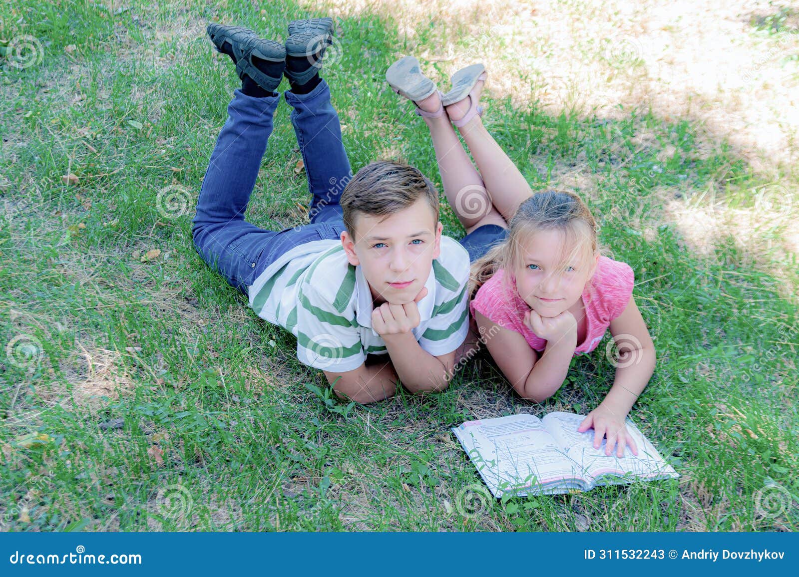 Boy with a Girl Doing Homework on the Grass in the Park Stock Image ...