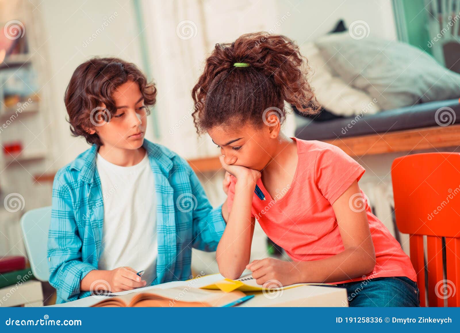A Boy and a Girl Doing Their Home Task Together Stock Photo - Image of ...