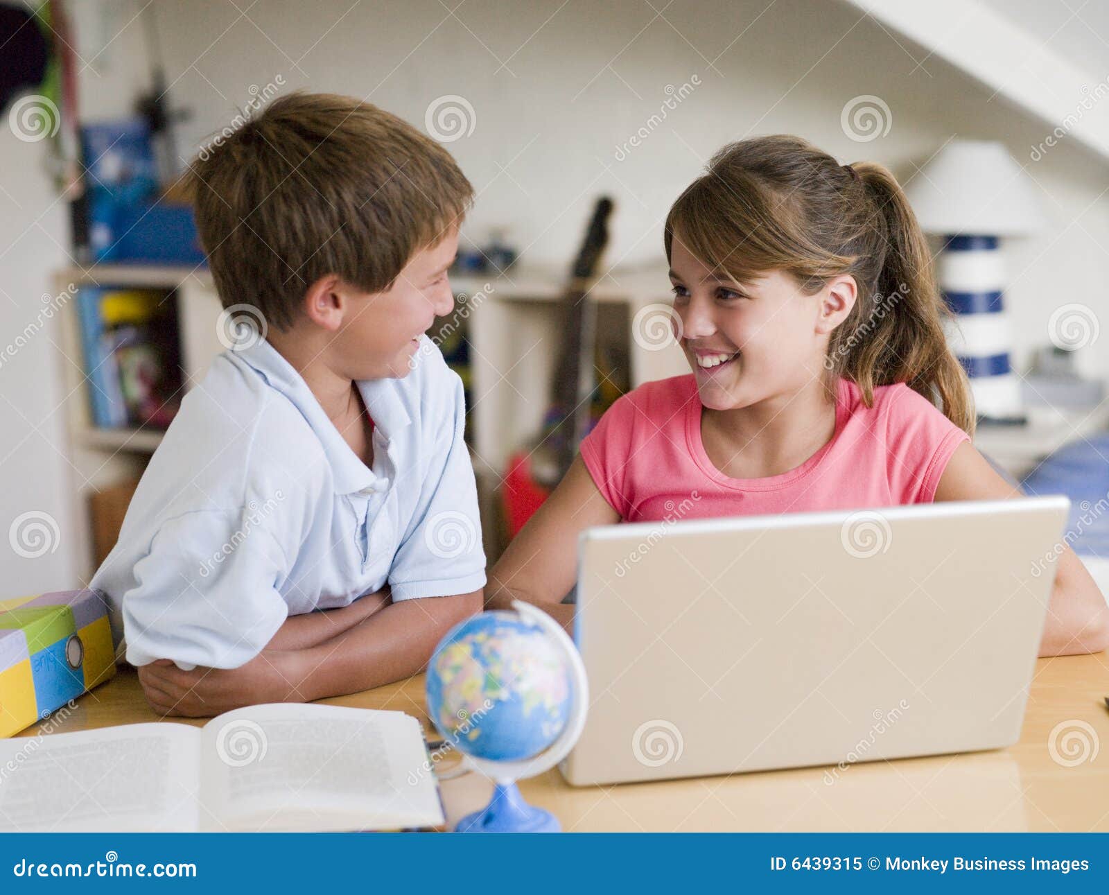 Boy and Girl Doing Their Homework on a Laptop Stock Image - Image of ...
