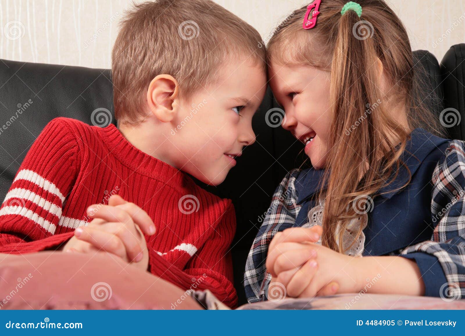 Boy and Girl Face To Face on Sofa Stock Image - Image of enjoyment ...
