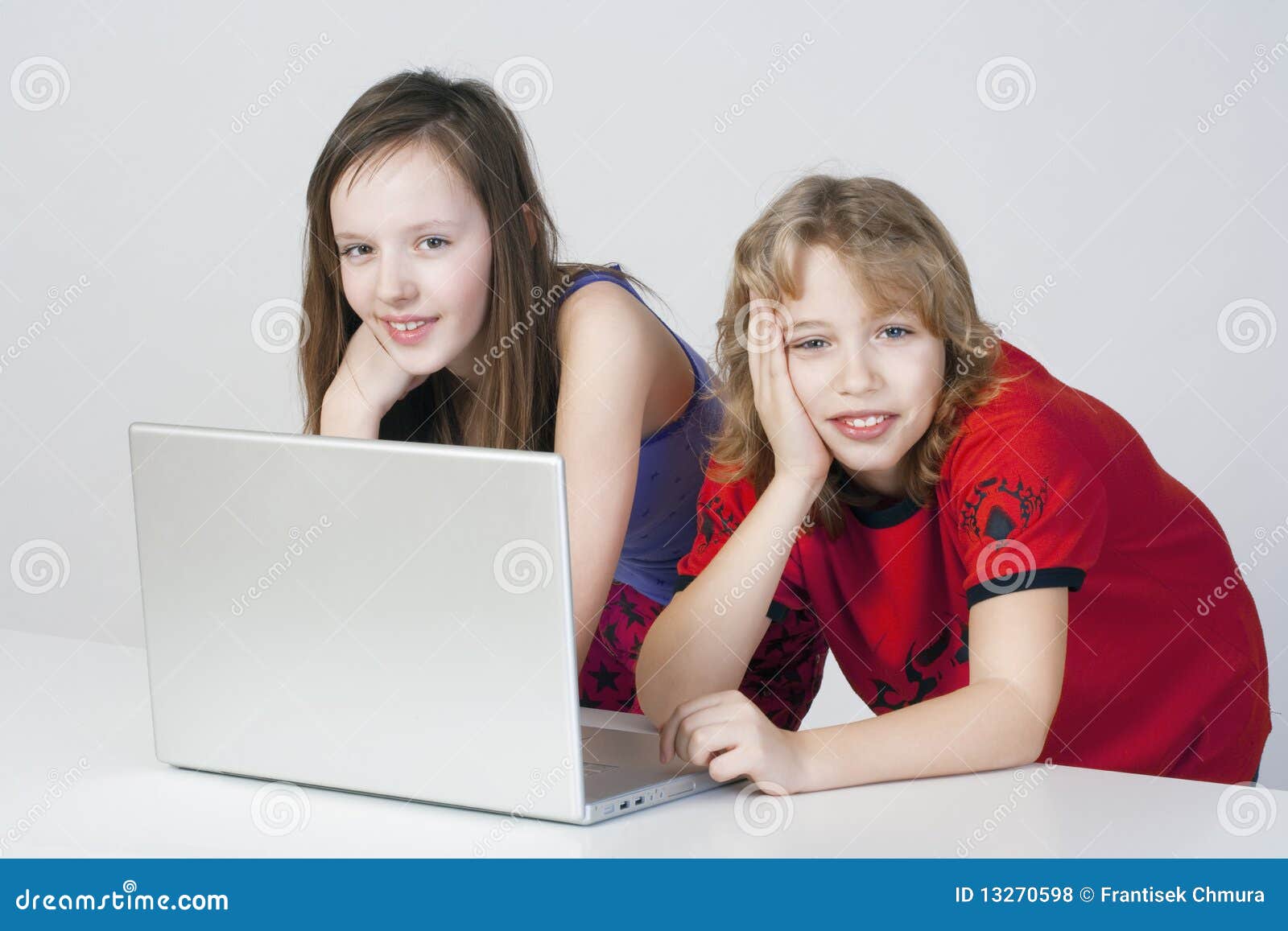 Boy and girl with laptop stock photo. Image of surfing - 13270598