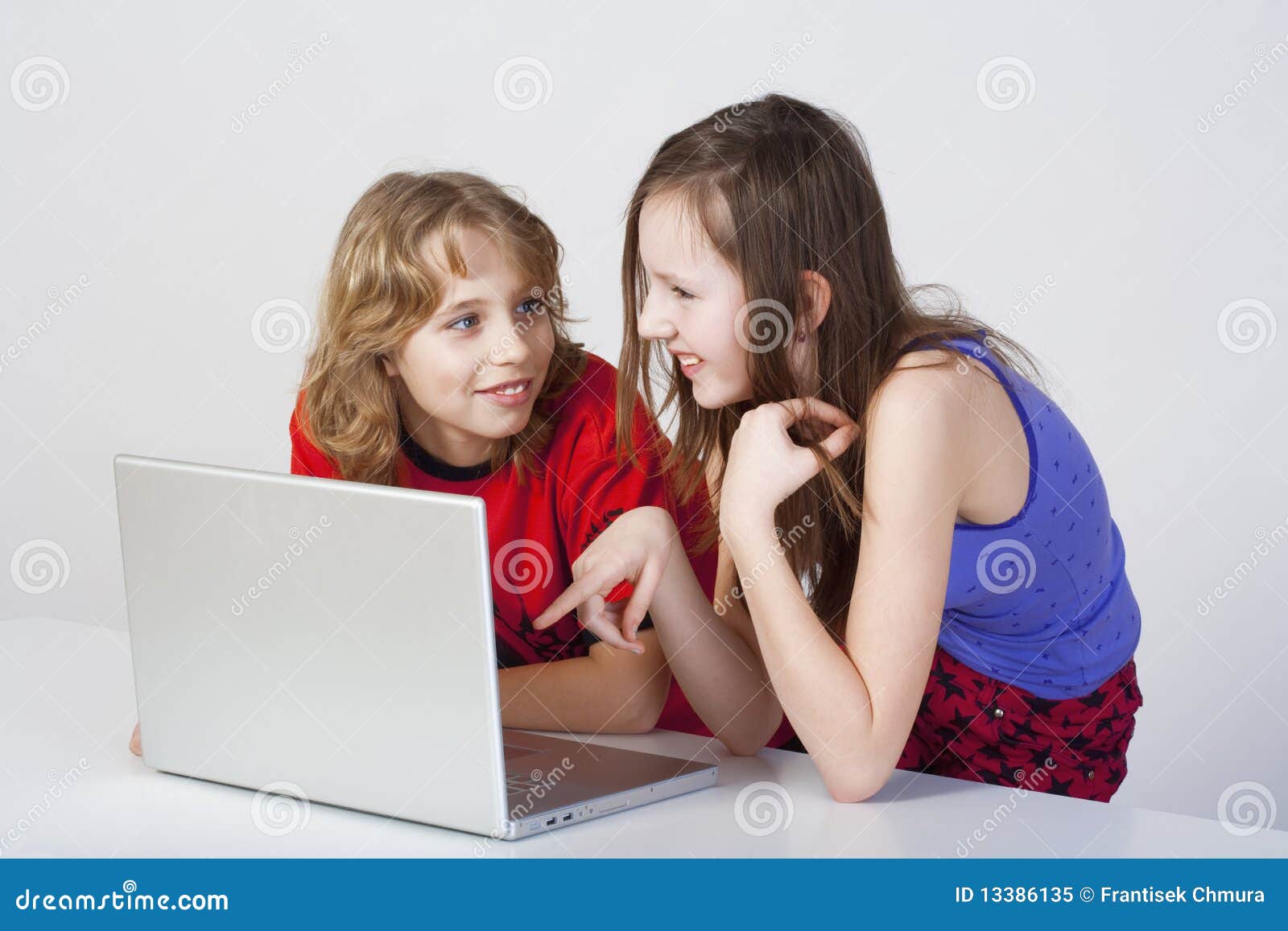 Boy and girl with laptop stock image. Image of computer - 13386135