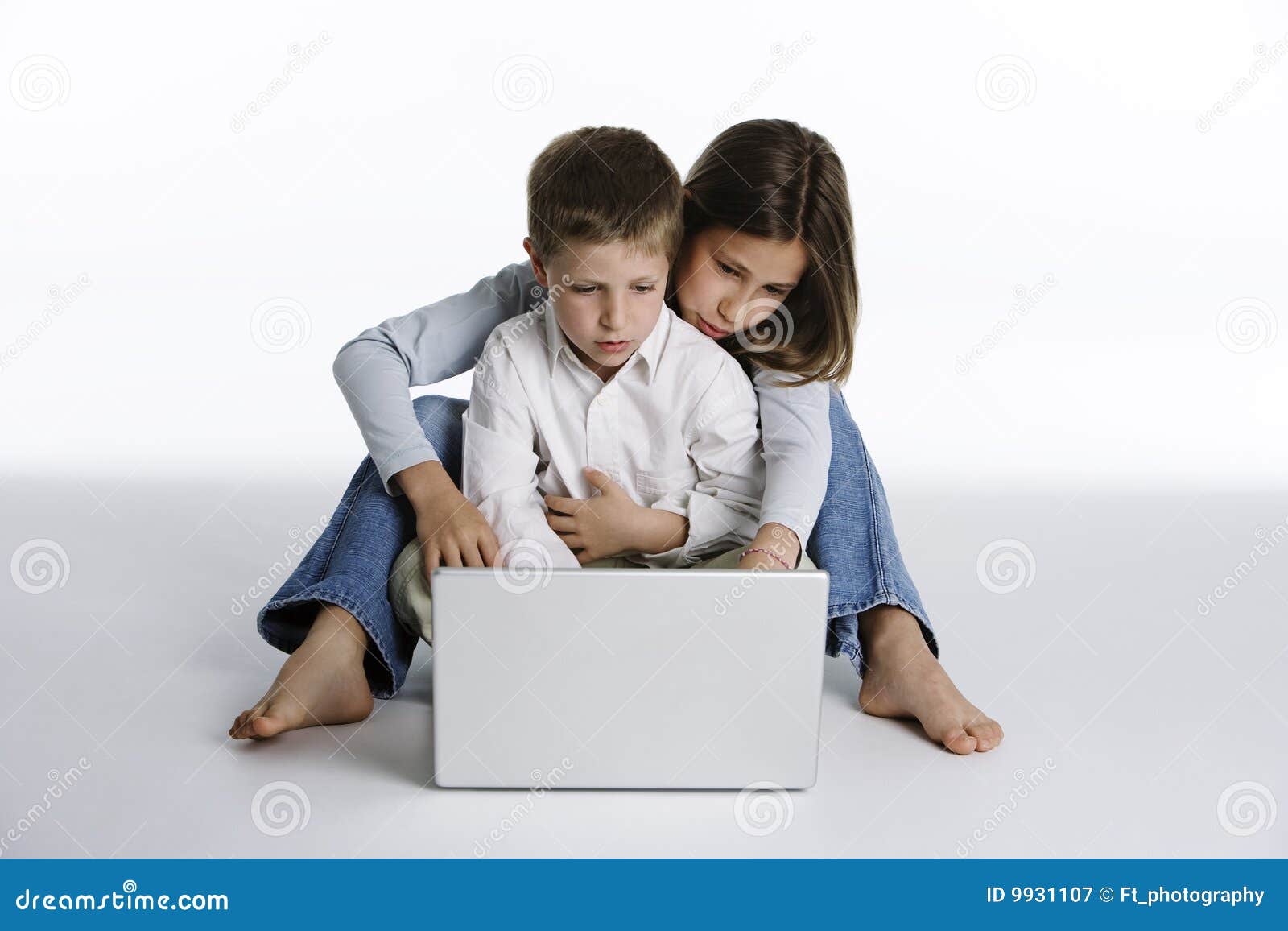 Boy And Girl With Laptop Computer Picture. Image: 9931107
