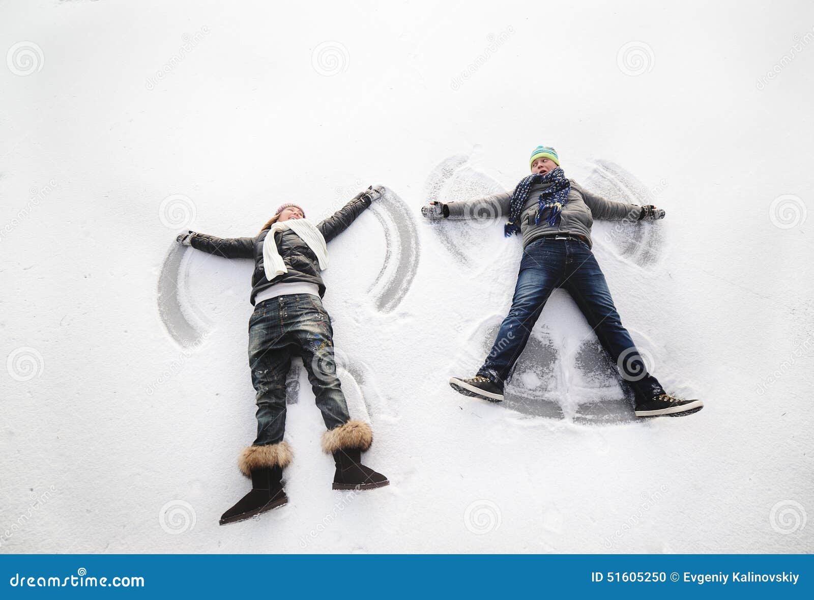 Boy and Girl Making Snow Angels Stock Photo - Image of childhood, white ...