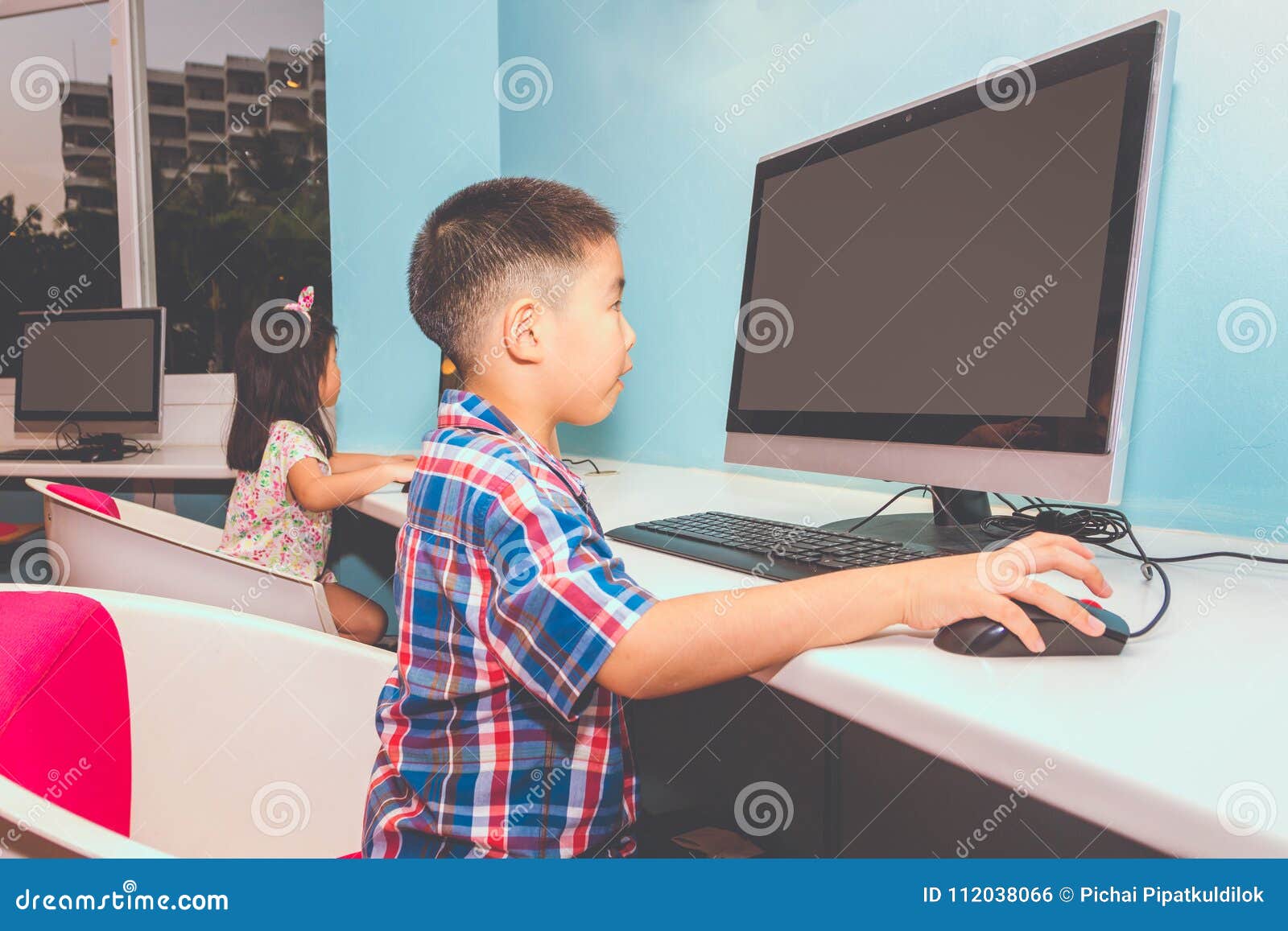 Boy and Girl Playing with a Computer Stock Photo - Image of children ...