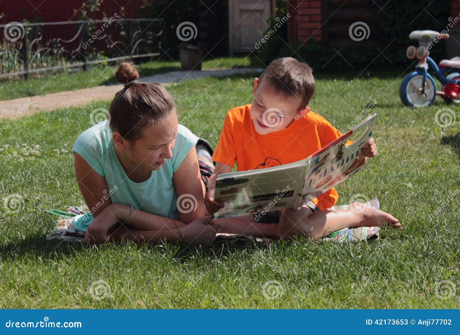 Boy and girl reading book stock image. Image of child - 42173653